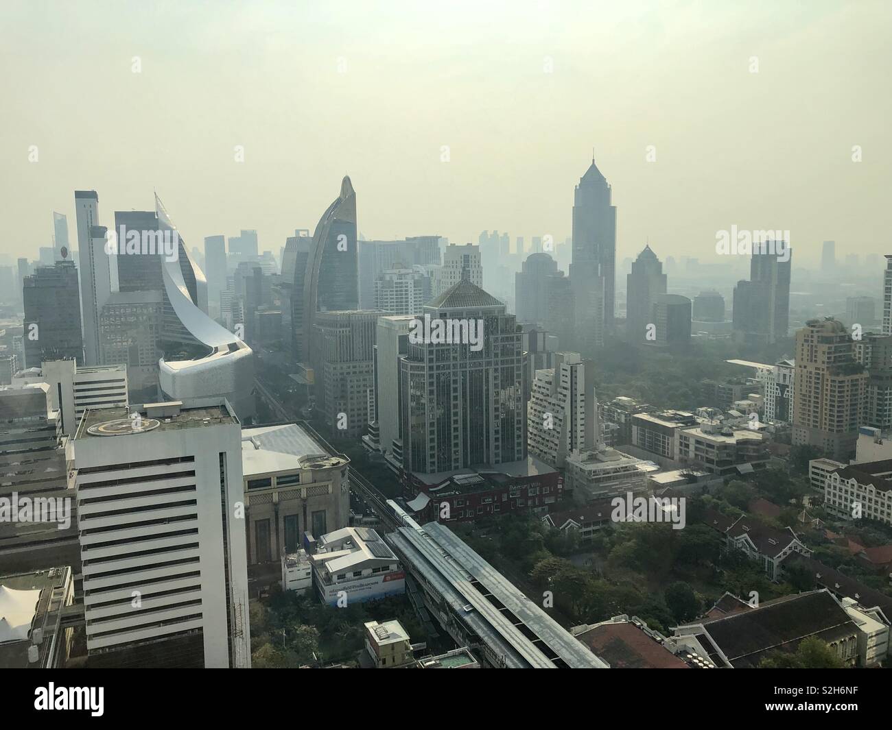 Hazy view of Bangkok from high rise hotel room Stock Photo - Alamy