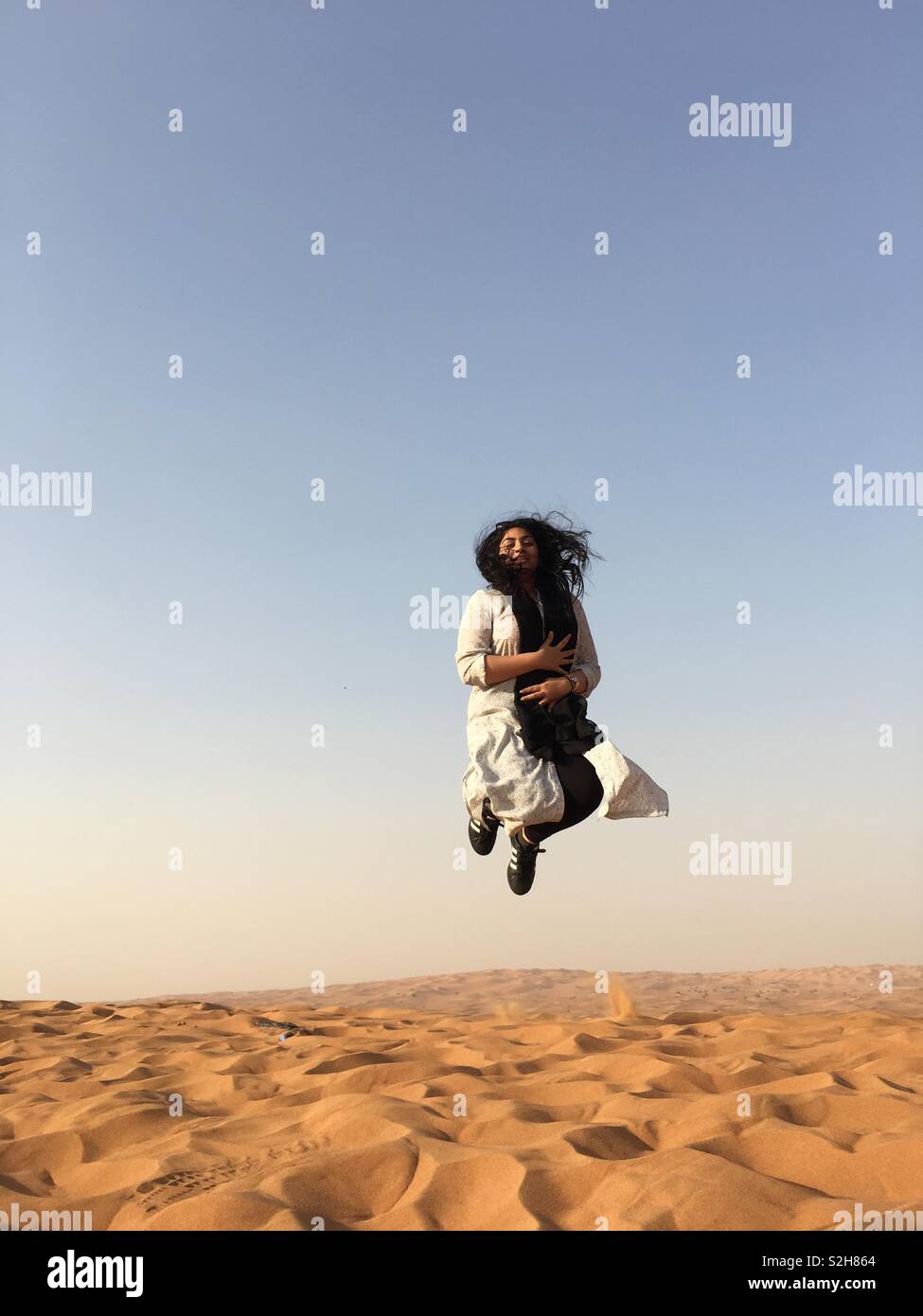 Sand dune girl Stock Photo - Alamy