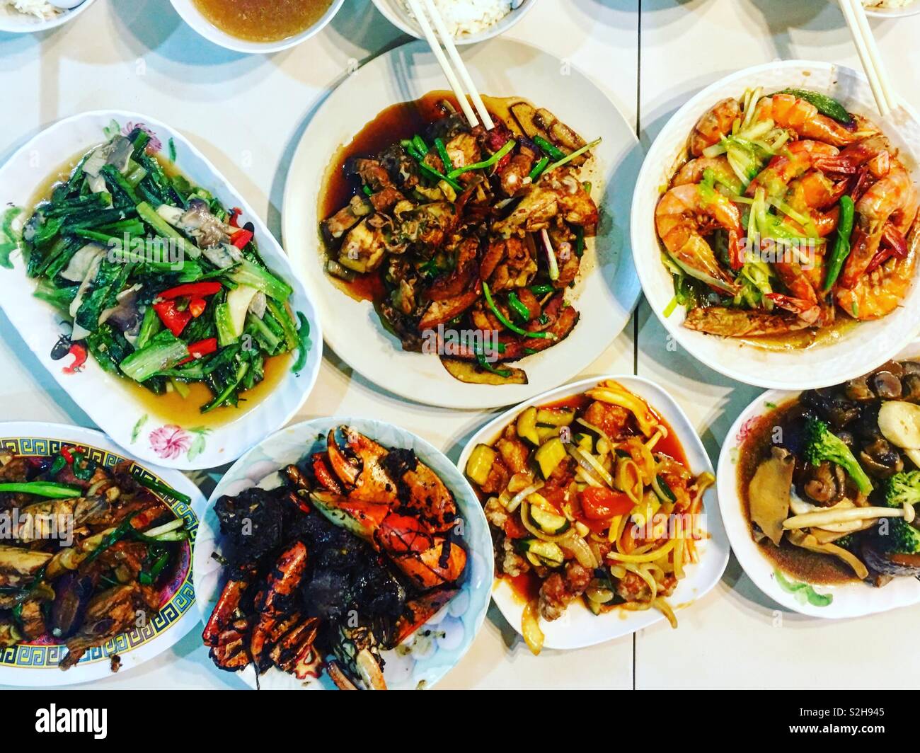 Table laden with dishes to celebrate Chinese New Year Stock Photo - Alamy