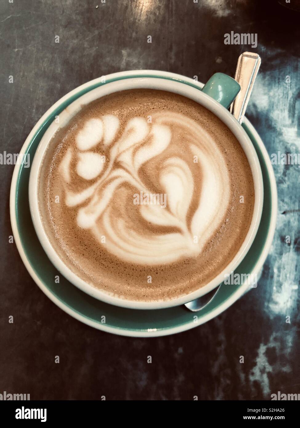 Flat white with beautiful microfoam art Stock Photo - Alamy