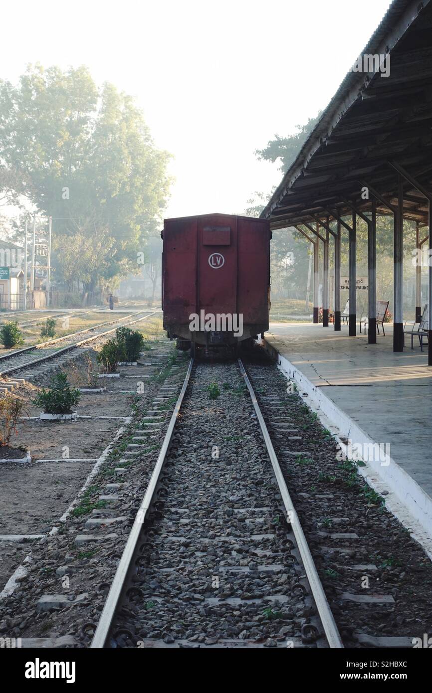 Single wagon standing at the railway station, railroad platform ...