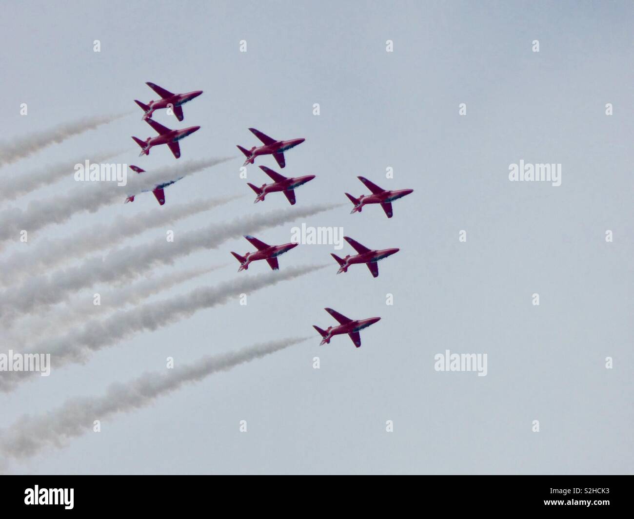 Upside down red arrows Stock Photo - Alamy