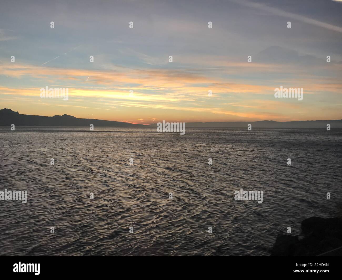 Sunset on the water Stock Photo - Alamy