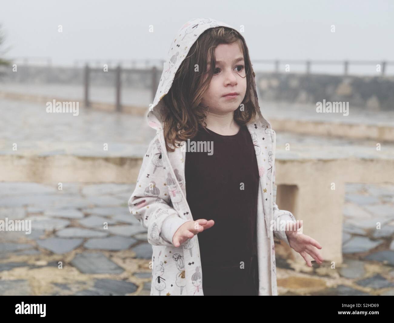 Afraid children walking in the mist Stock Photo - Alamy