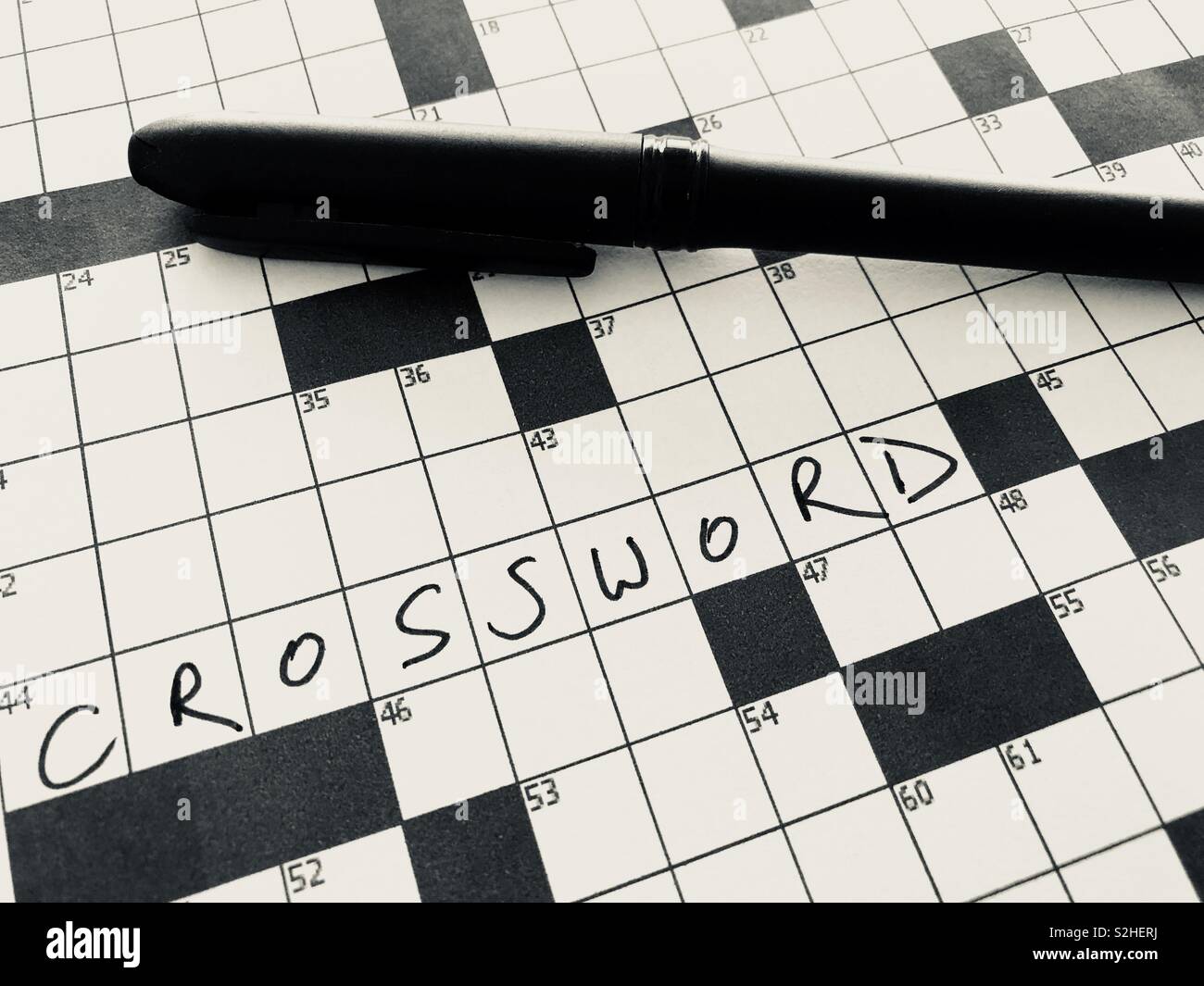 Crossword puzzle and pen Stock Photo - Alamy