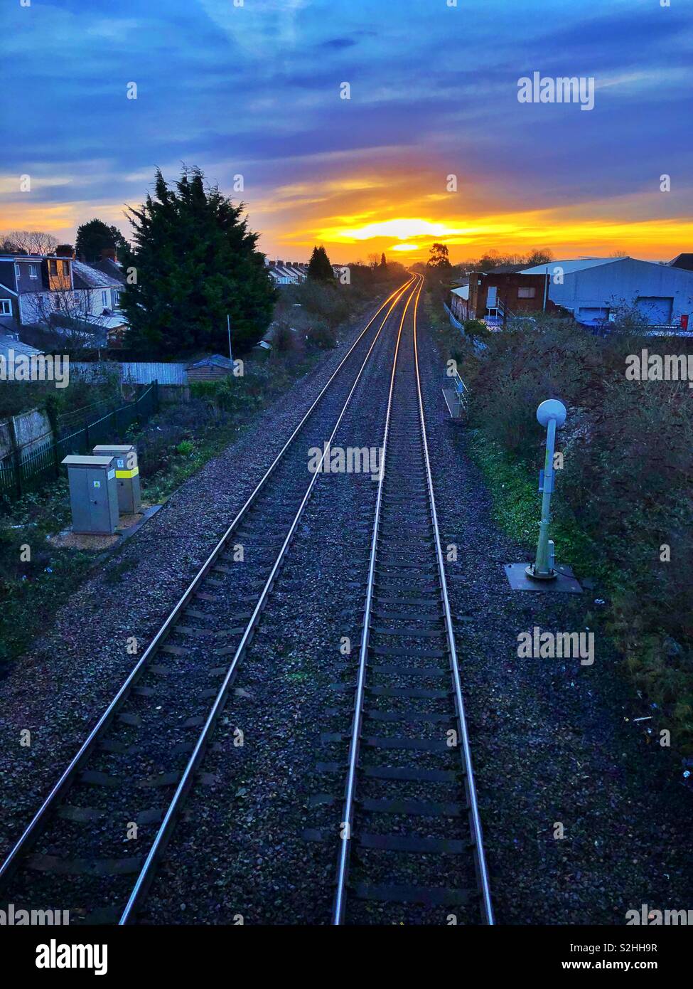 Sunrise over a railway track Stock Photo - Alamy