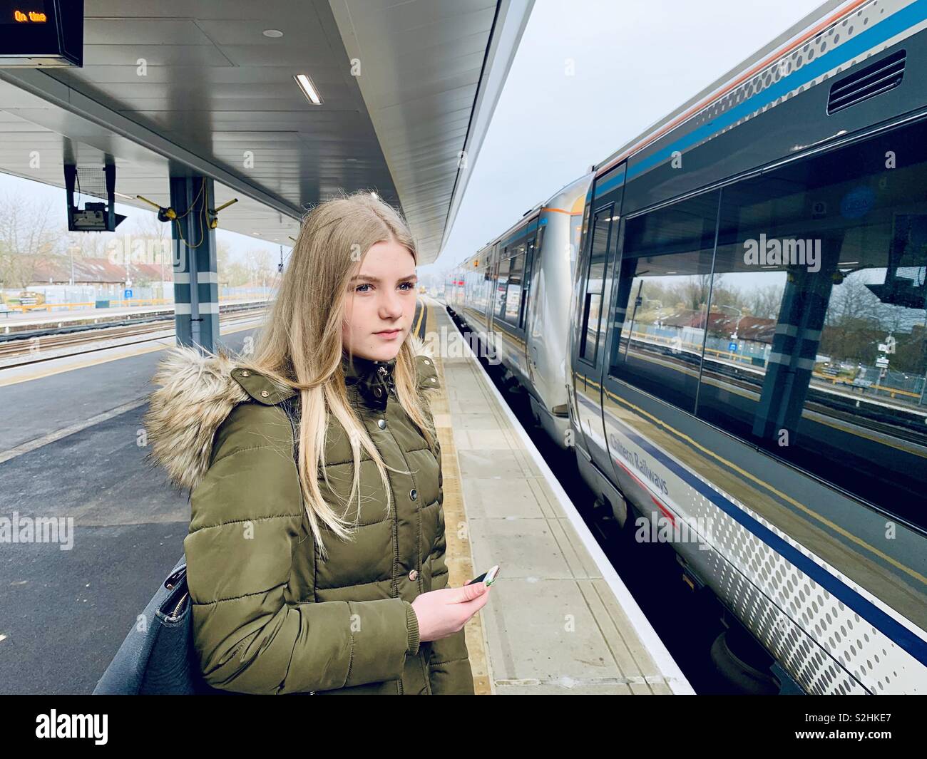 Teenager on train platform Stock Photo - Alamy