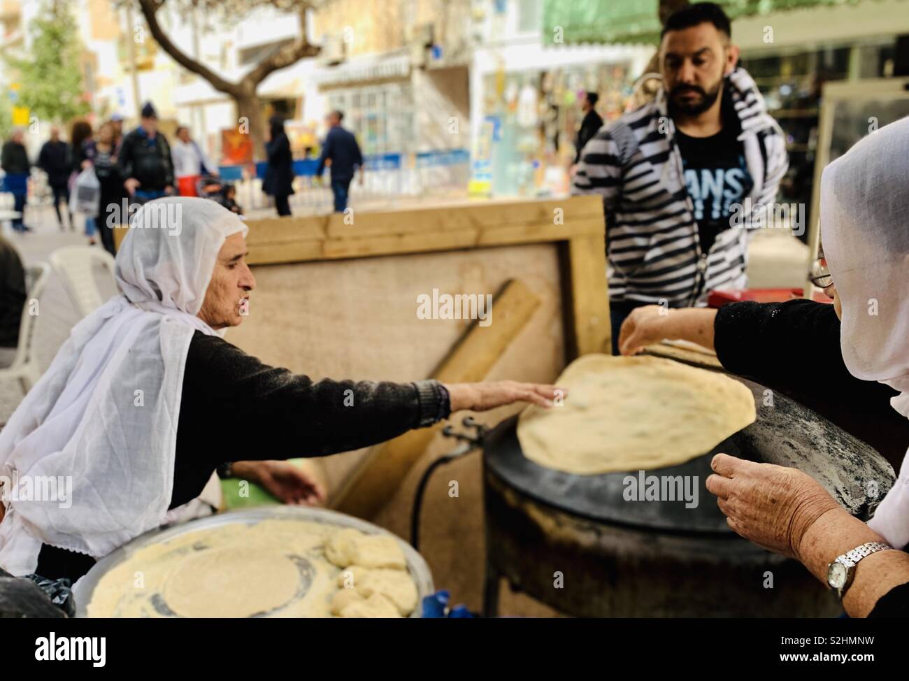 Druz women preparing traditional Druz pita bread Stock Photo - Alamy