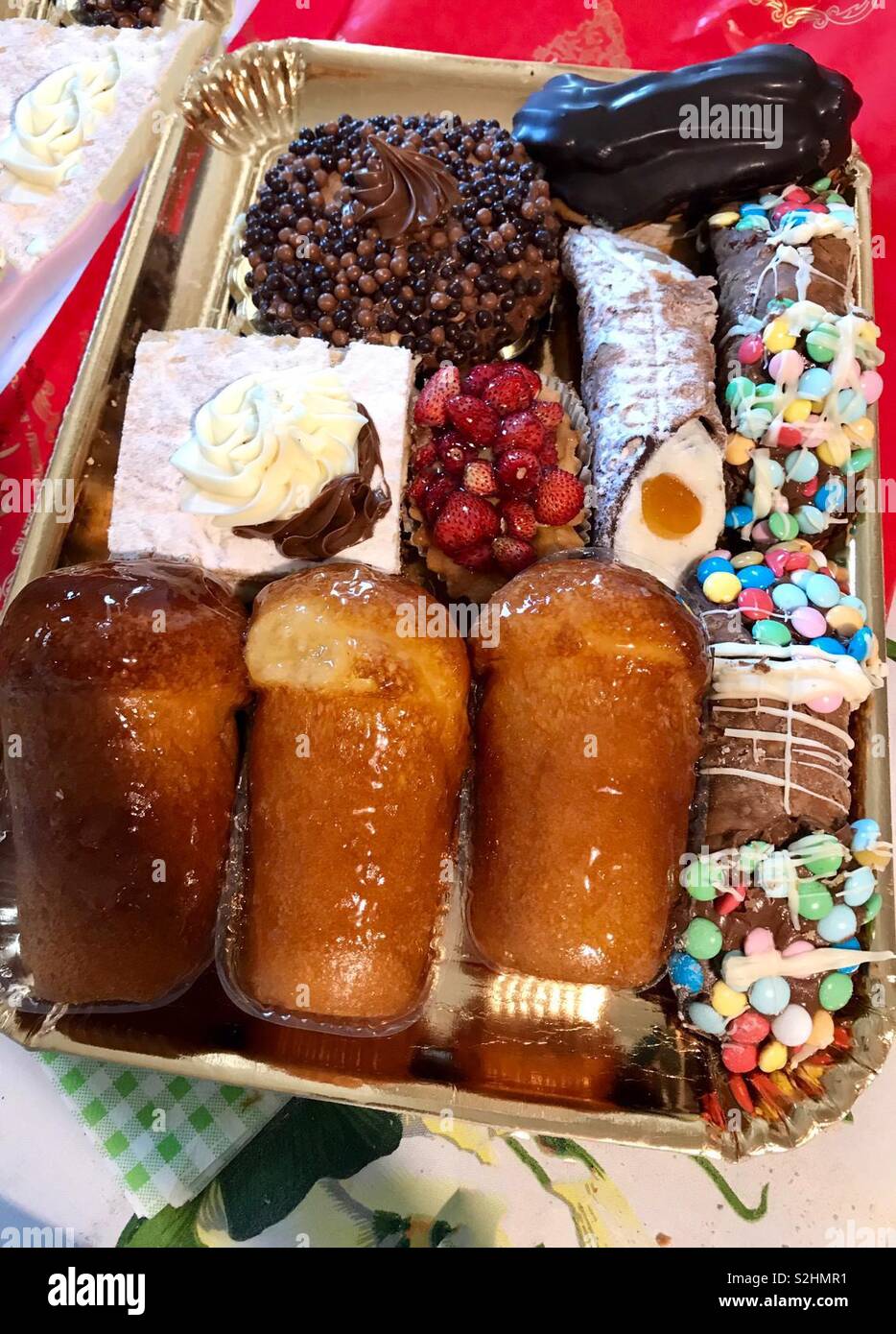 Italian sweets baba chocolate cakes choux cream cannoli Stock Photo - Alamy