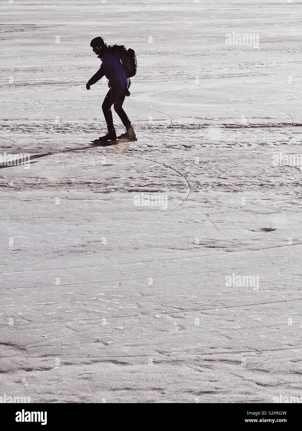 Man long distance ice skating on Lake Malaren, Sweden, Scandinavia ...