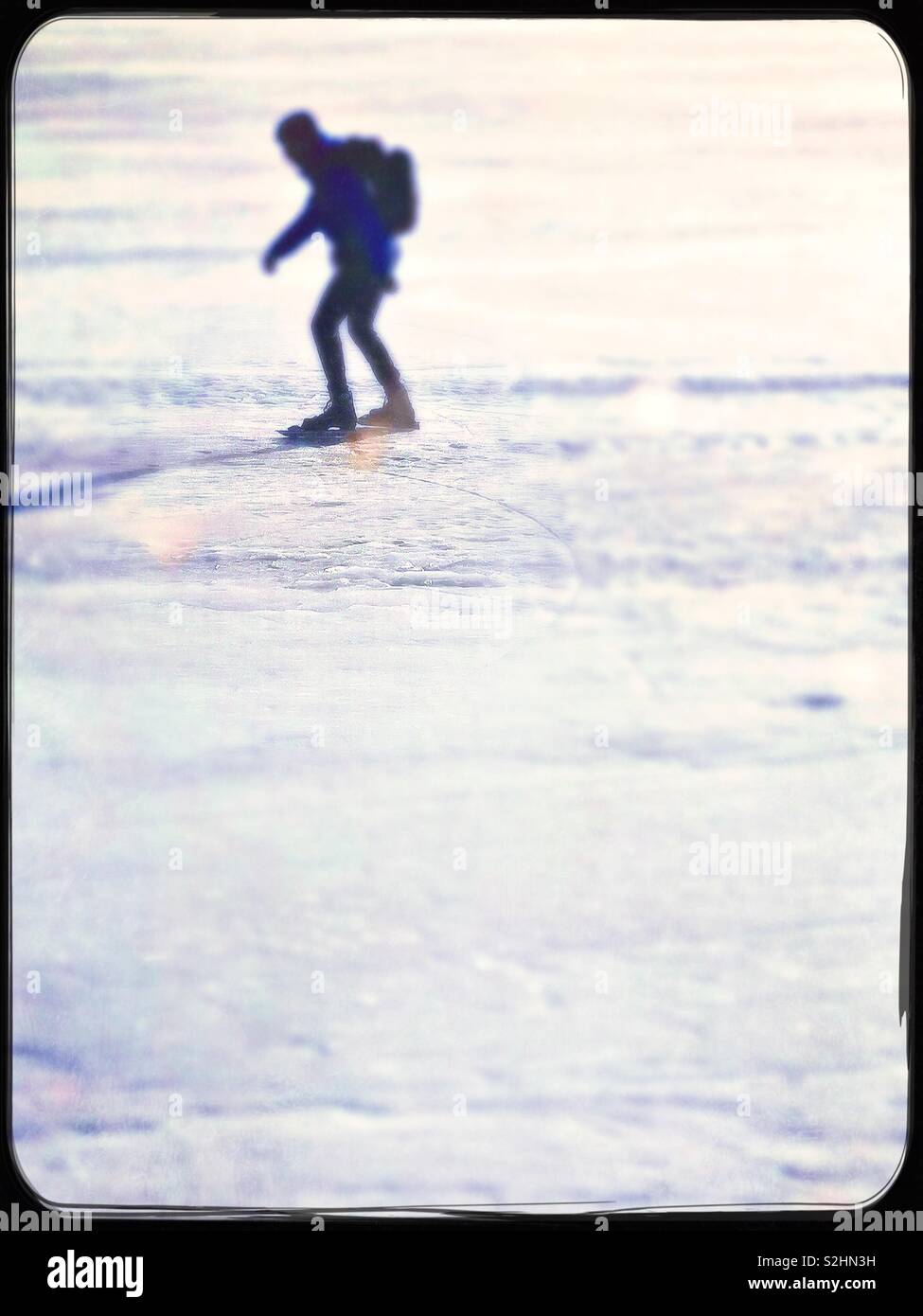 Man long distance ice skating across Lake Malaren, Sweden, Scandinavia ...