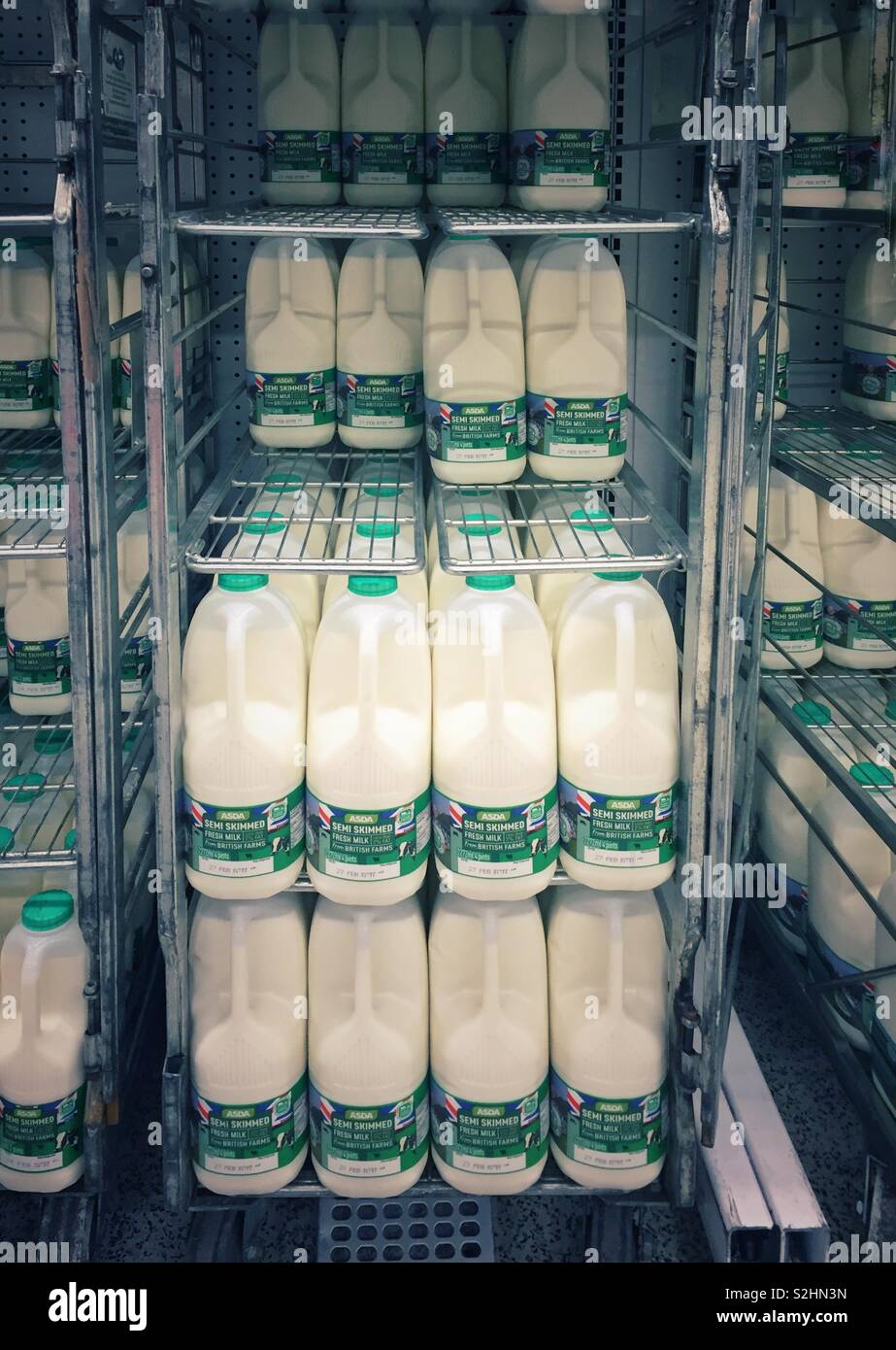 Bottles of milk on sale in a supermarket Stock Photo - Alamy