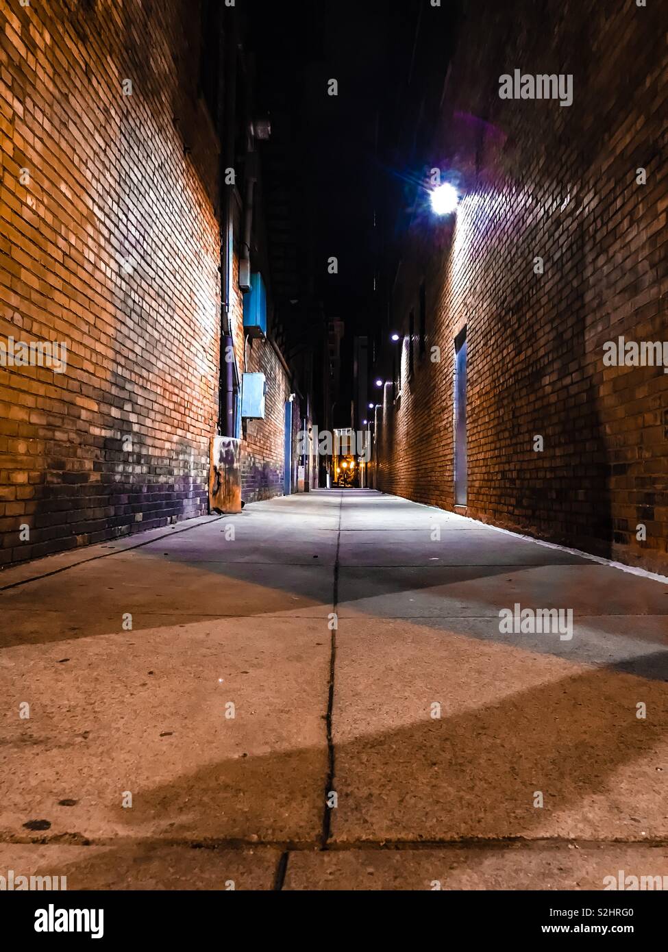 Downtown alley, geometric shadows Stock Photo - Alamy
