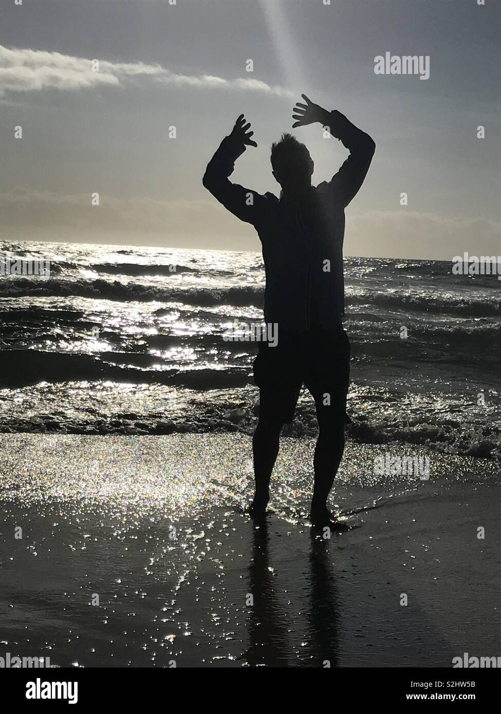 Sunrise dance happy feeling mood ocean waves emotions Stock Photo - Alamy