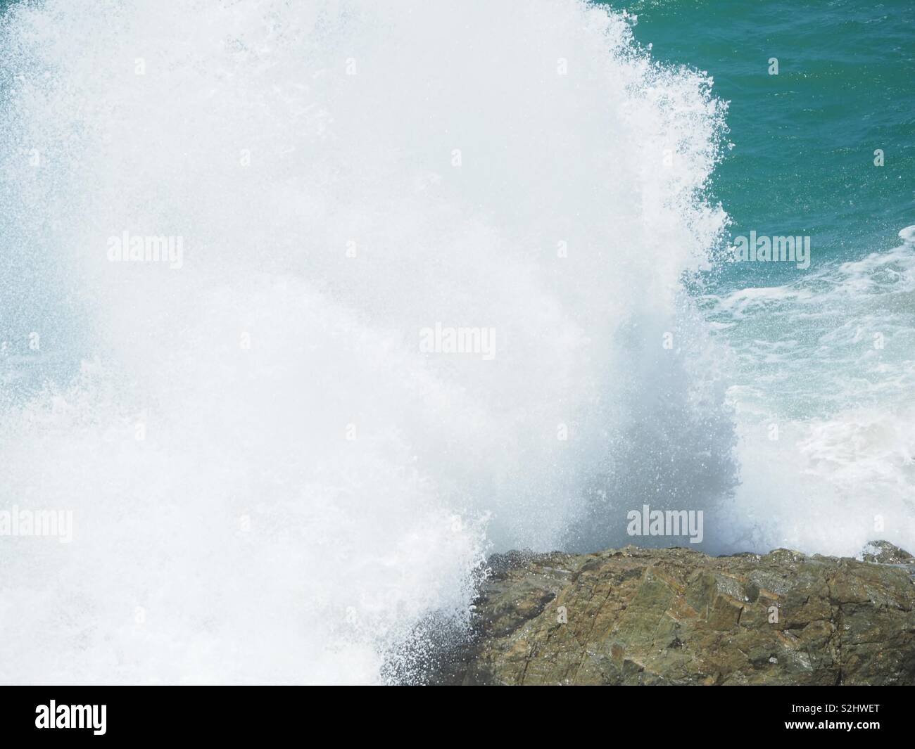 Waves crashing onto rocks at Moonie Beach NSW. Sea Spray Stock Photo ...