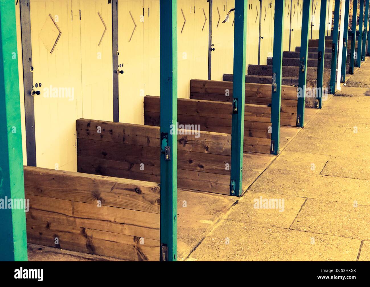 Abstract formed by wooden dividers on a row of beach huts Stock Photo ...