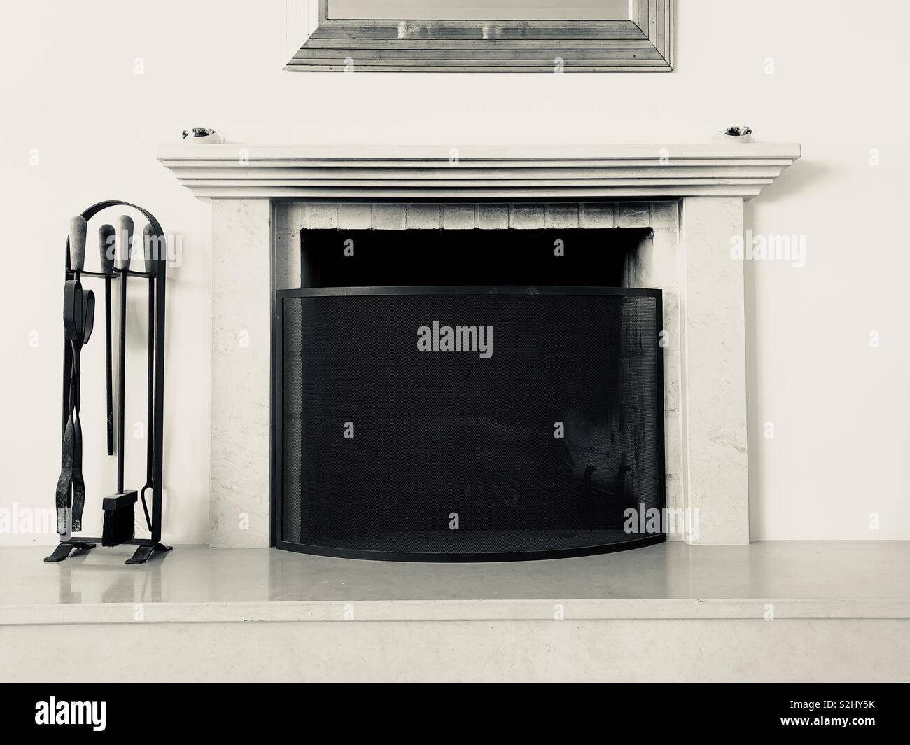 Fireplace with fireside set Stock Photo - Alamy