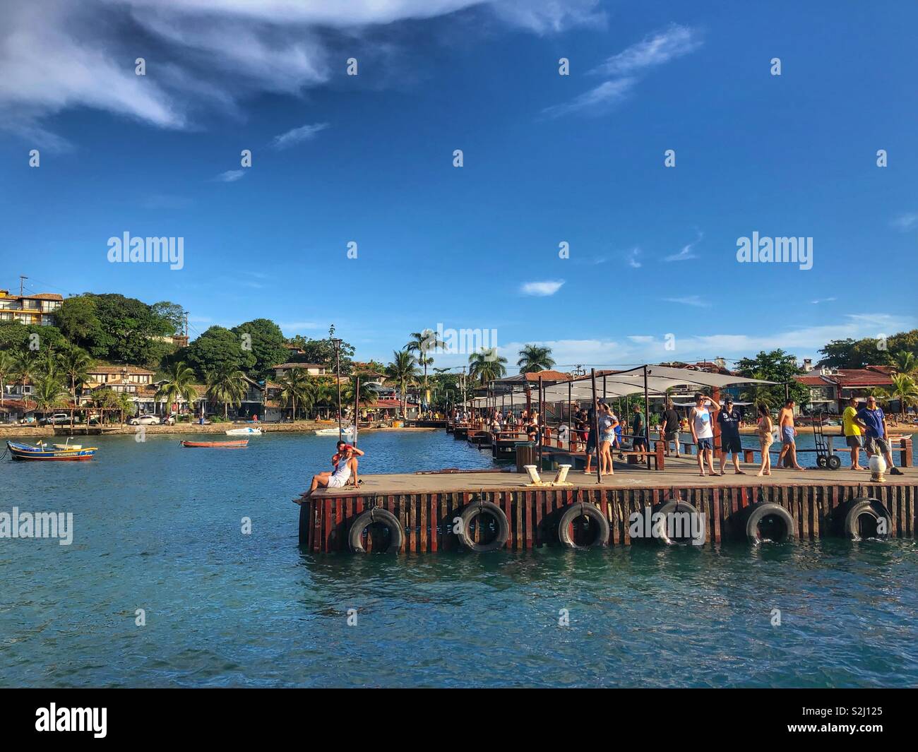 People standing on a pier in Búzios, Brazil Stock Photo - Alamy
