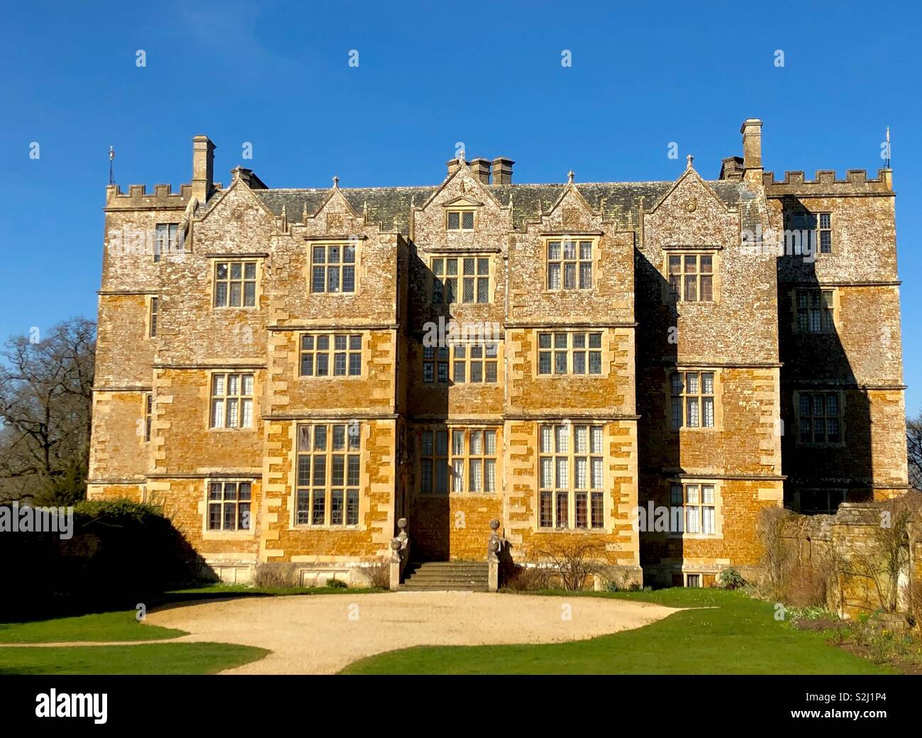 Chastleton Manor in the Cotswolds brilliantly lit against a deep blue ...