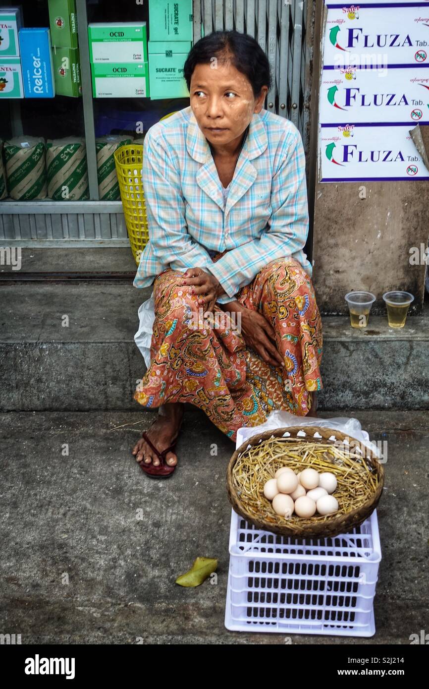 Single burmese lady selling fresh eggs on the streets in asia Stock ...