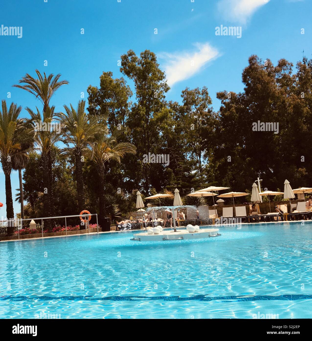 Holiday time at the pool Stock Photo - Alamy