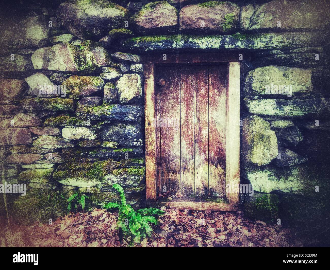 Old wooden doorway in an old stone barn, St Fagans Museum of Welsh Life ...