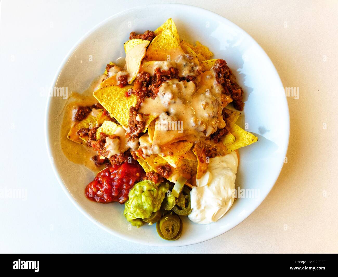 Nachos salsa guacamole jalapeños hi-res stock photography and images ...
