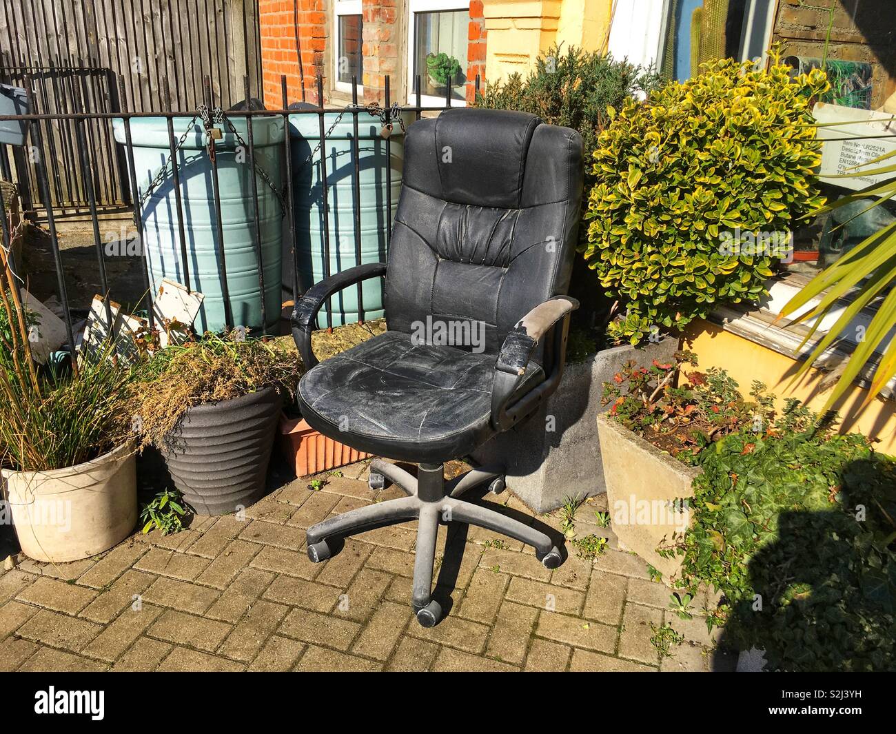 Office chair in the street Stock Photo - Alamy