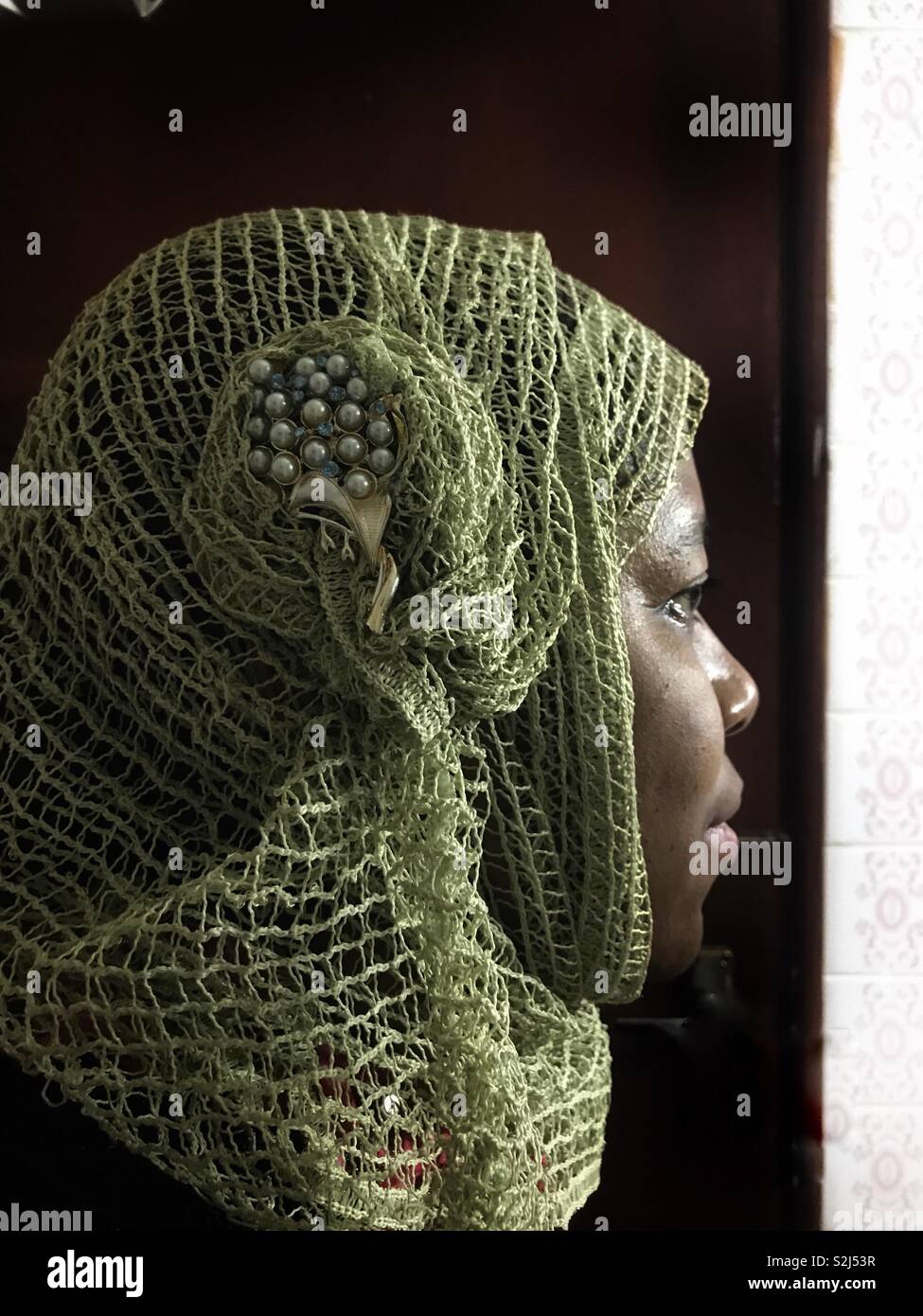 Woman with green scarf hi-res stock photography and images - Alamy