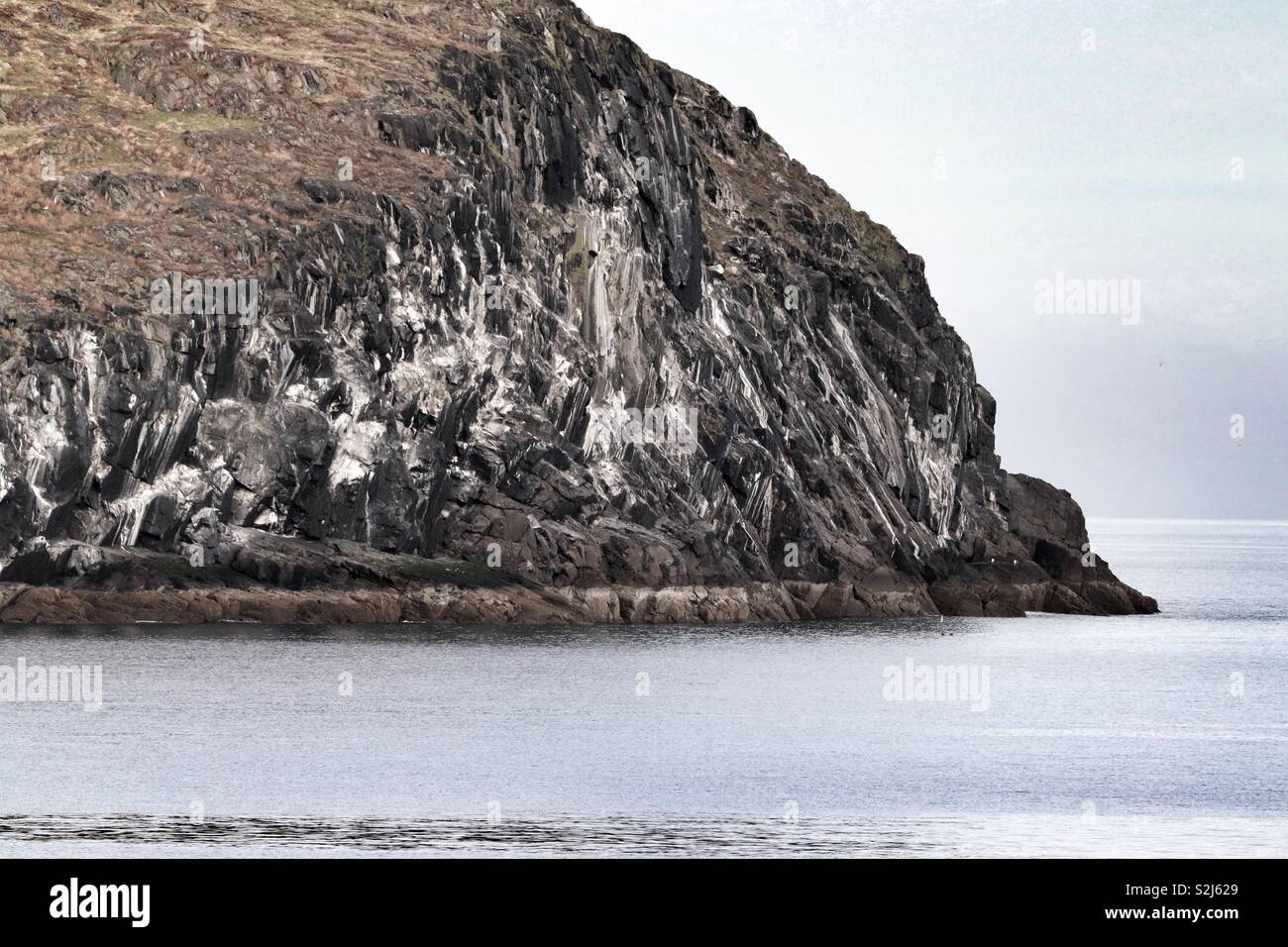 Rugged cliff face Stock Photo - Alamy