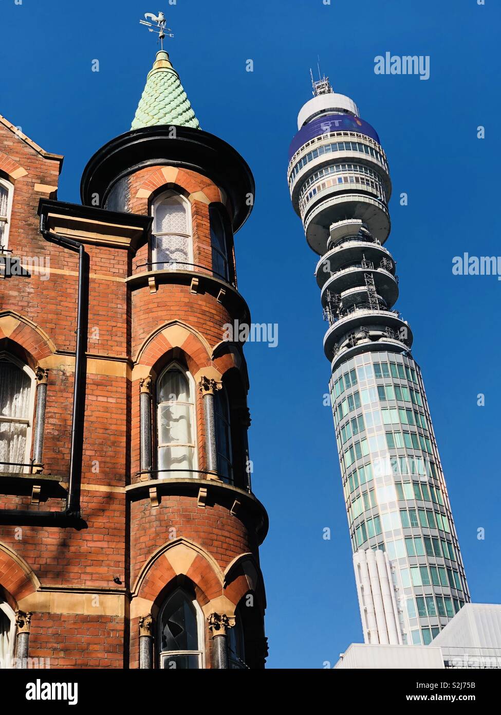 Bt tower next to the king and queen pub Stock Photo - Alamy