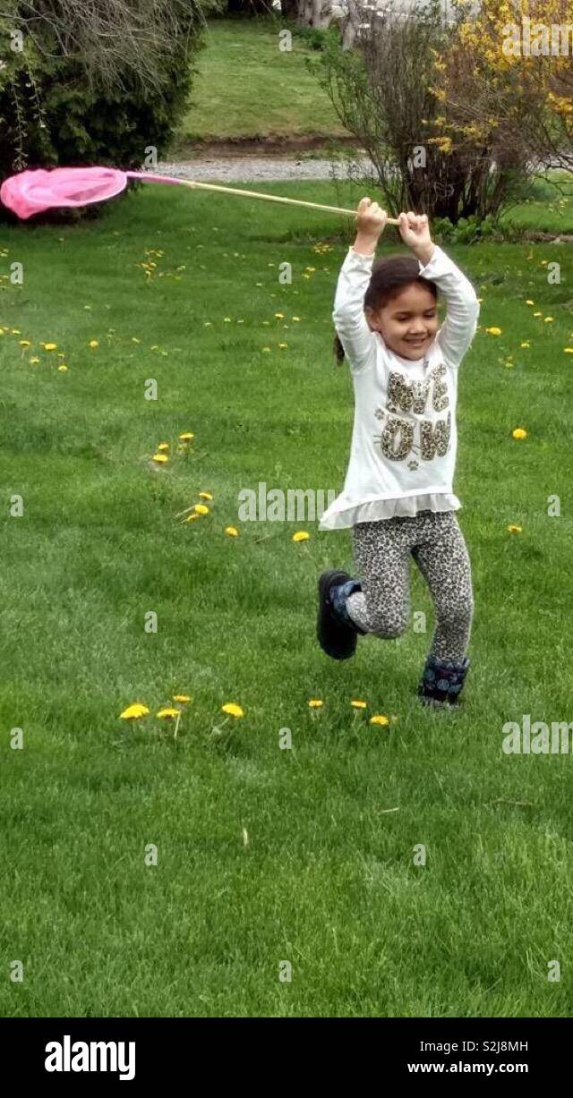 Girl catching butterflies hi-res stock photography and images - Alamy