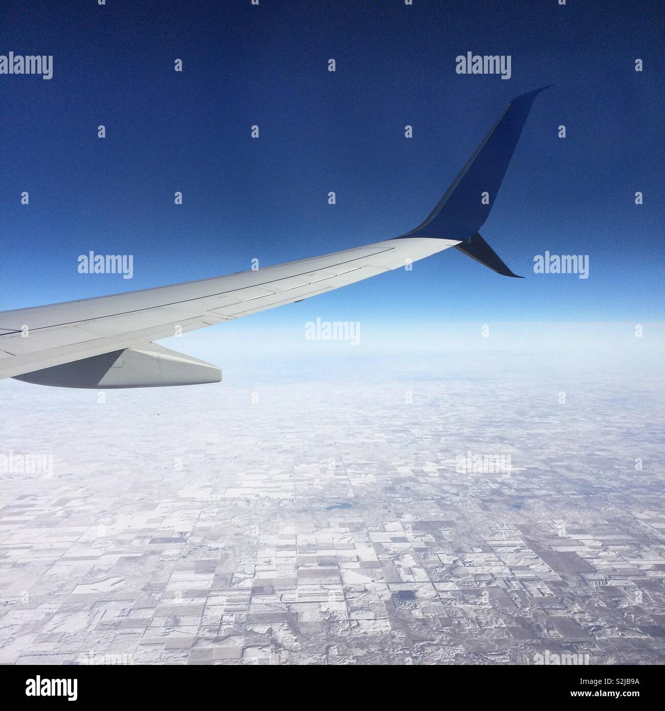 Flying over a snowy winter landscape, Kansas, United States Stock Photo ...