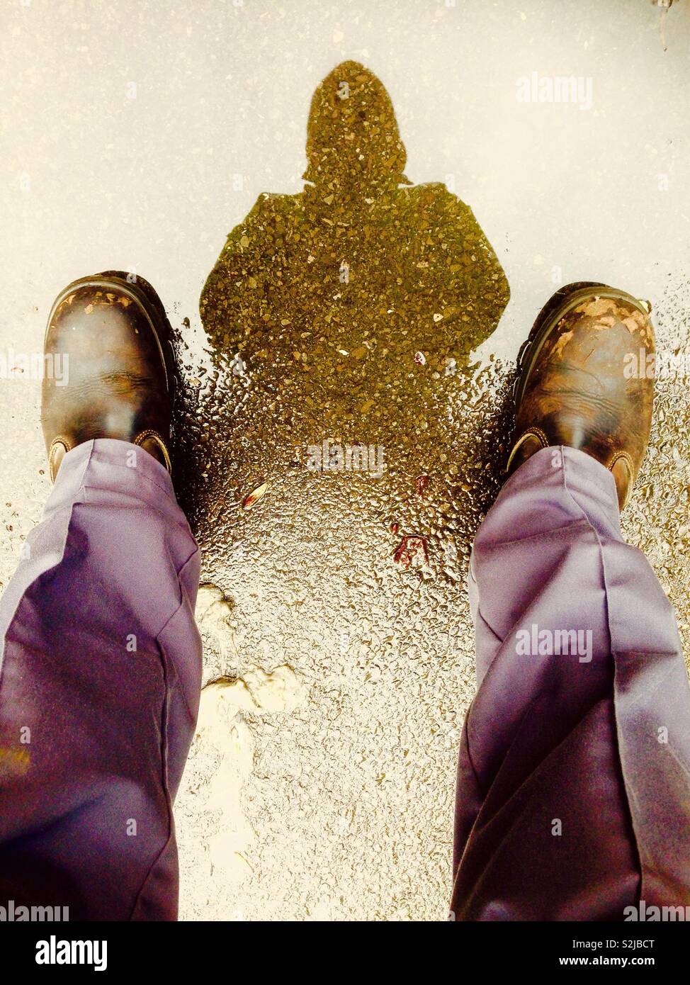 Man puddle water hi-res stock photography and images - Alamy