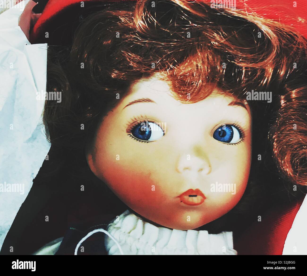 Porcelain doll face looking to the side Stock Photo - Alamy