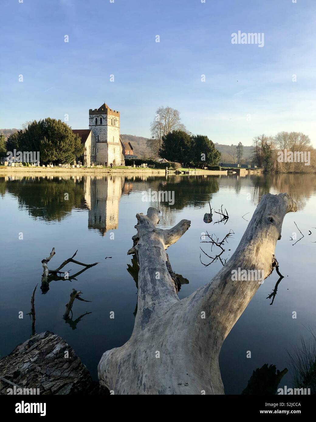 Reflection of ancient church tower in river Thames Stock Photo - Alamy