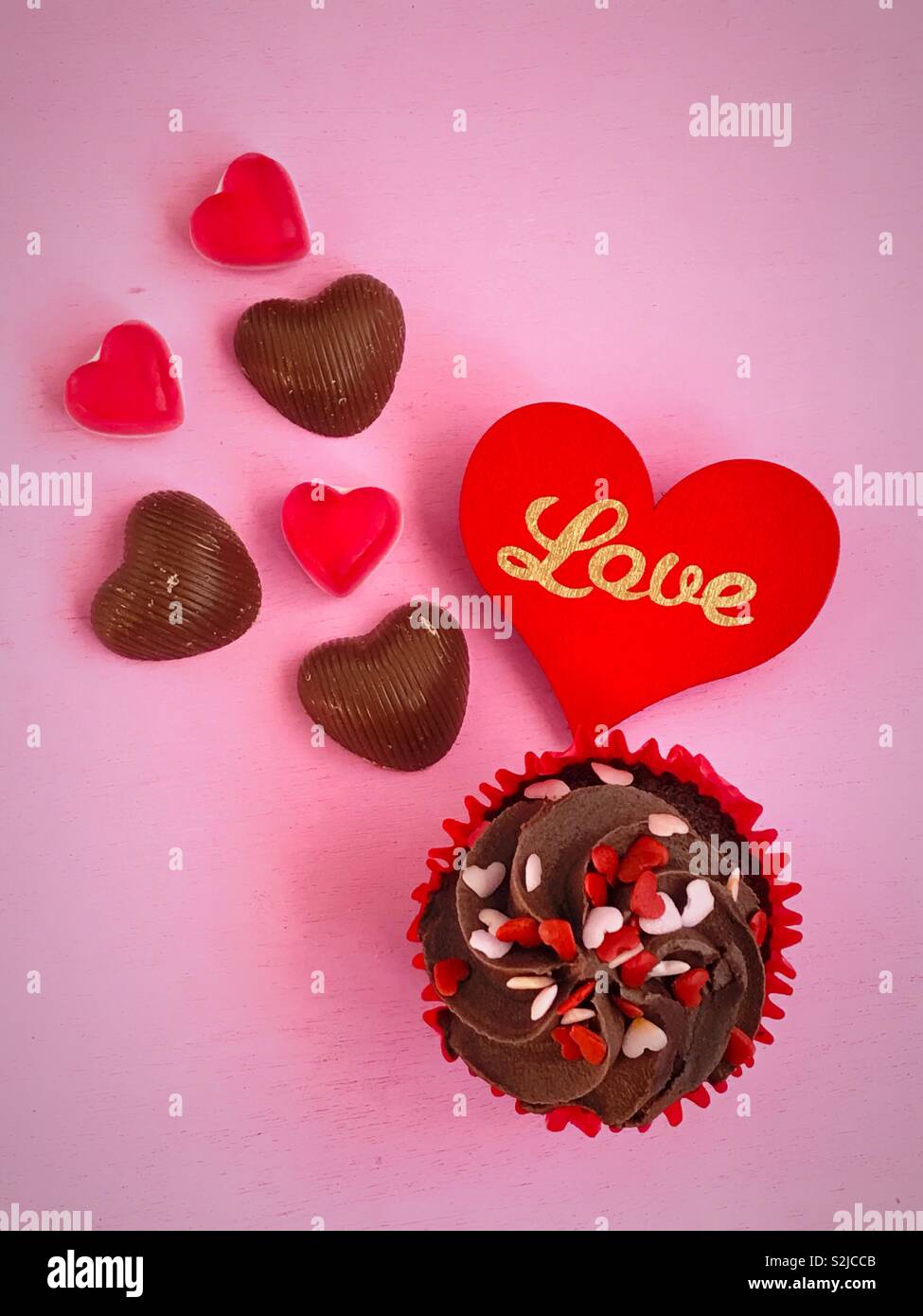 Love heart sweets and cake Stock Photo - Alamy