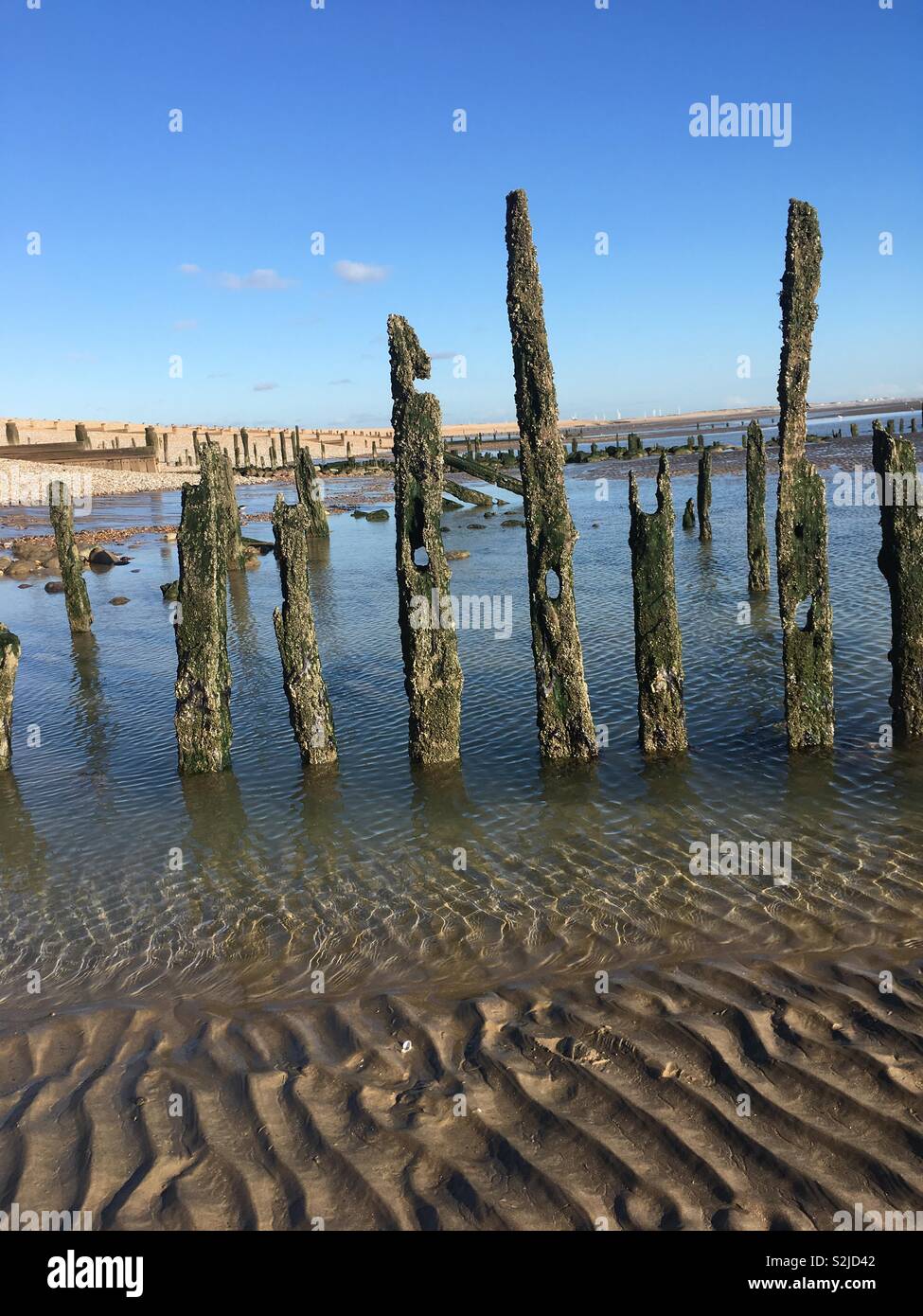 Low tide at the beach Stock Photo - Alamy