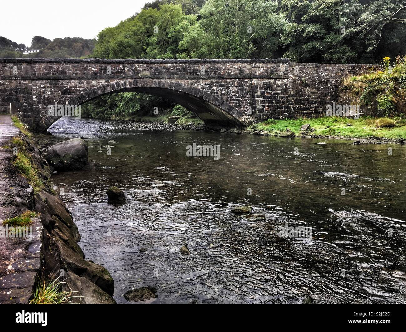 Water flowing under a bridge hi-res stock photography and images - Alamy