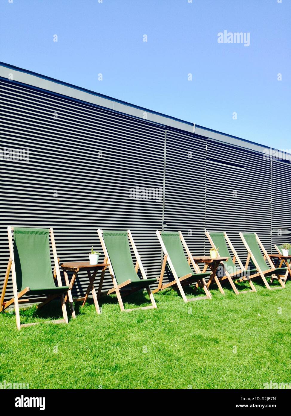 Chairs on grass hi-res stock photography and images - Alamy