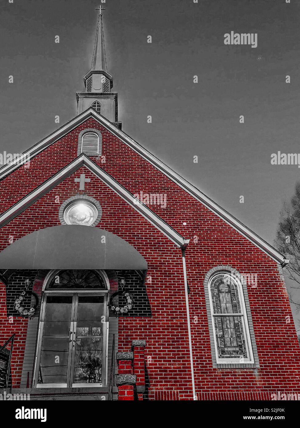 Red color pop photo of brick church front Stock Photo - Alamy