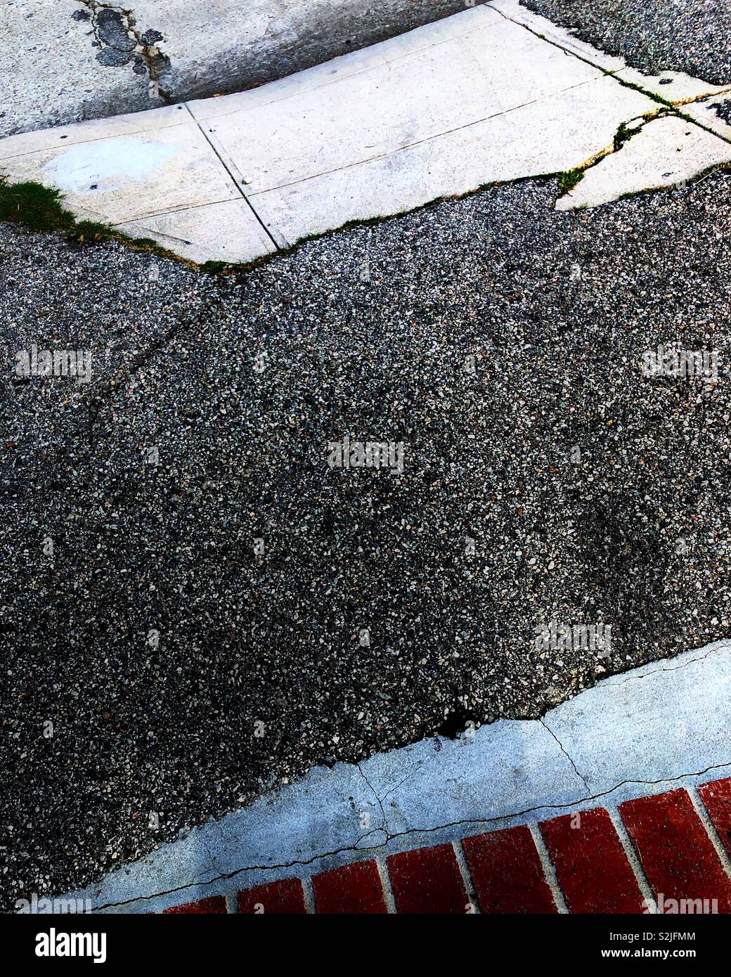 Unique driveway with asphalt patches Stock Photo - Alamy