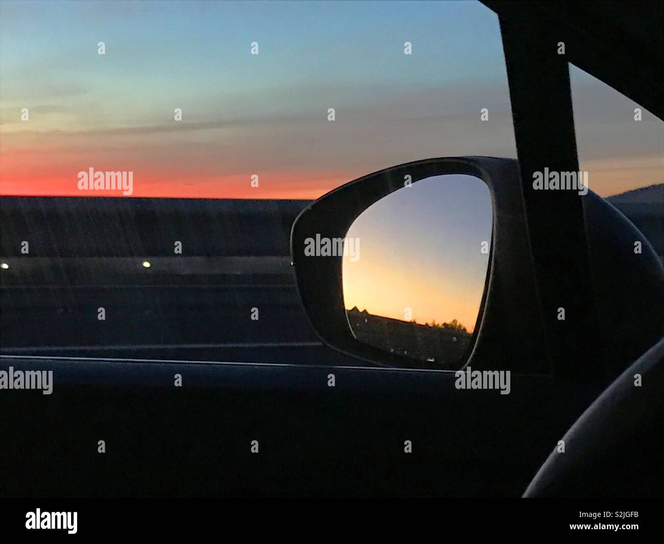 Sunset from inside a car Stock Photo - Alamy