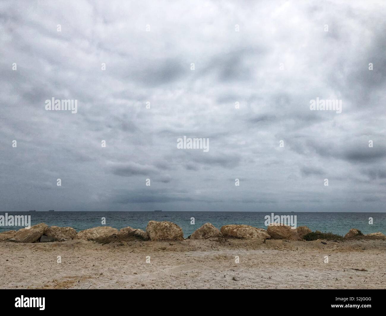 Grey skies over a grey sea Stock Photo - Alamy