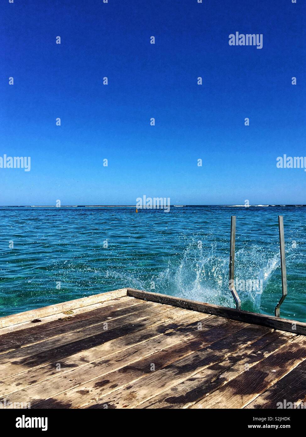 Make a splash as you jump in the water Stock Photo - Alamy