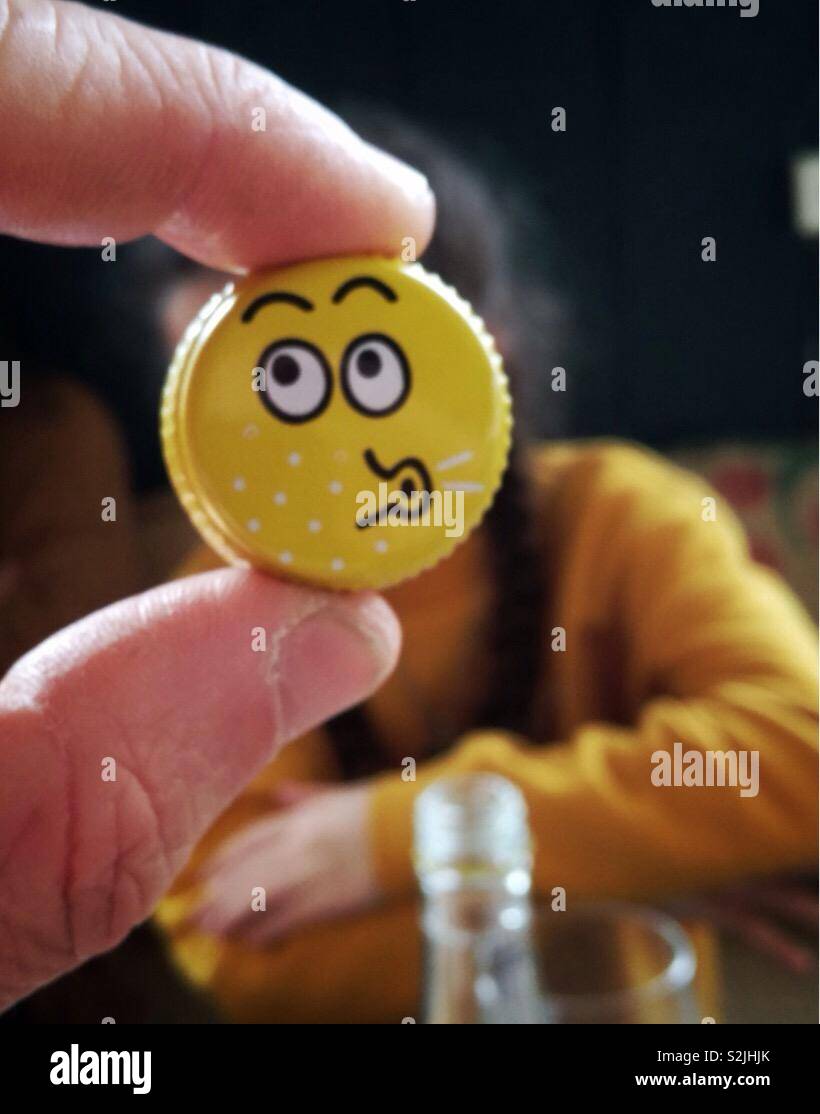 Bottle top head funny face expression blowing a raspberry yellow ...