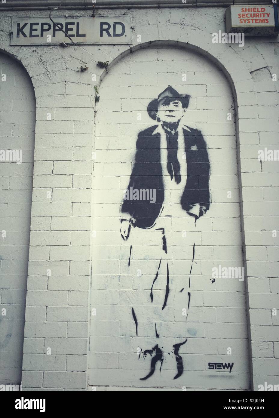 Street art portrait of Quentin Crisp on street corner in Chorlton ...