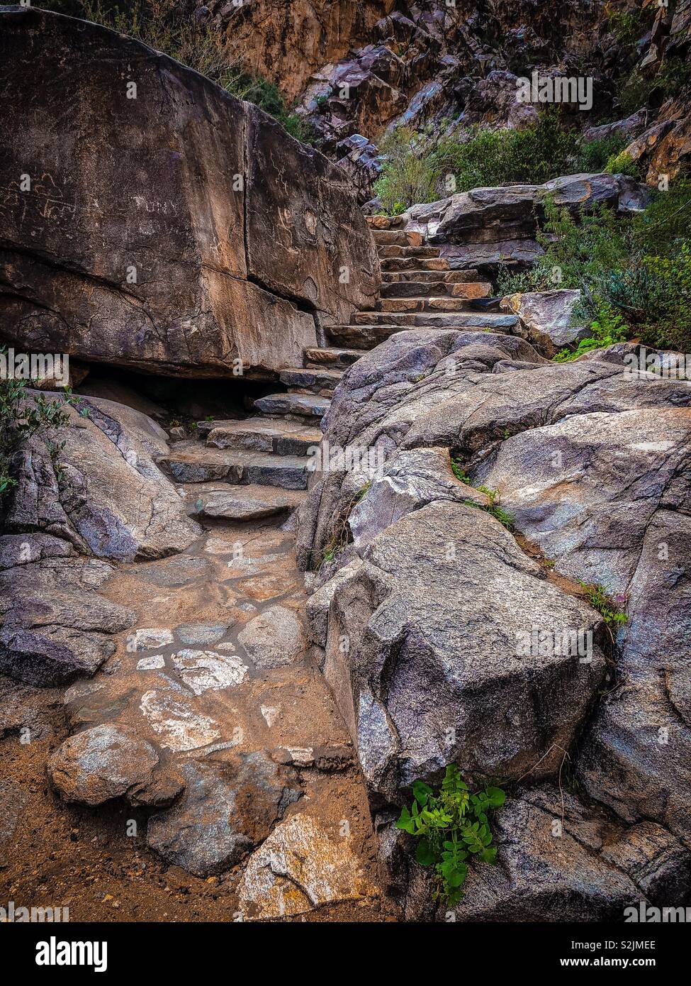 Rock pathway and stairs guiding you upwards Stock Photo - Alamy