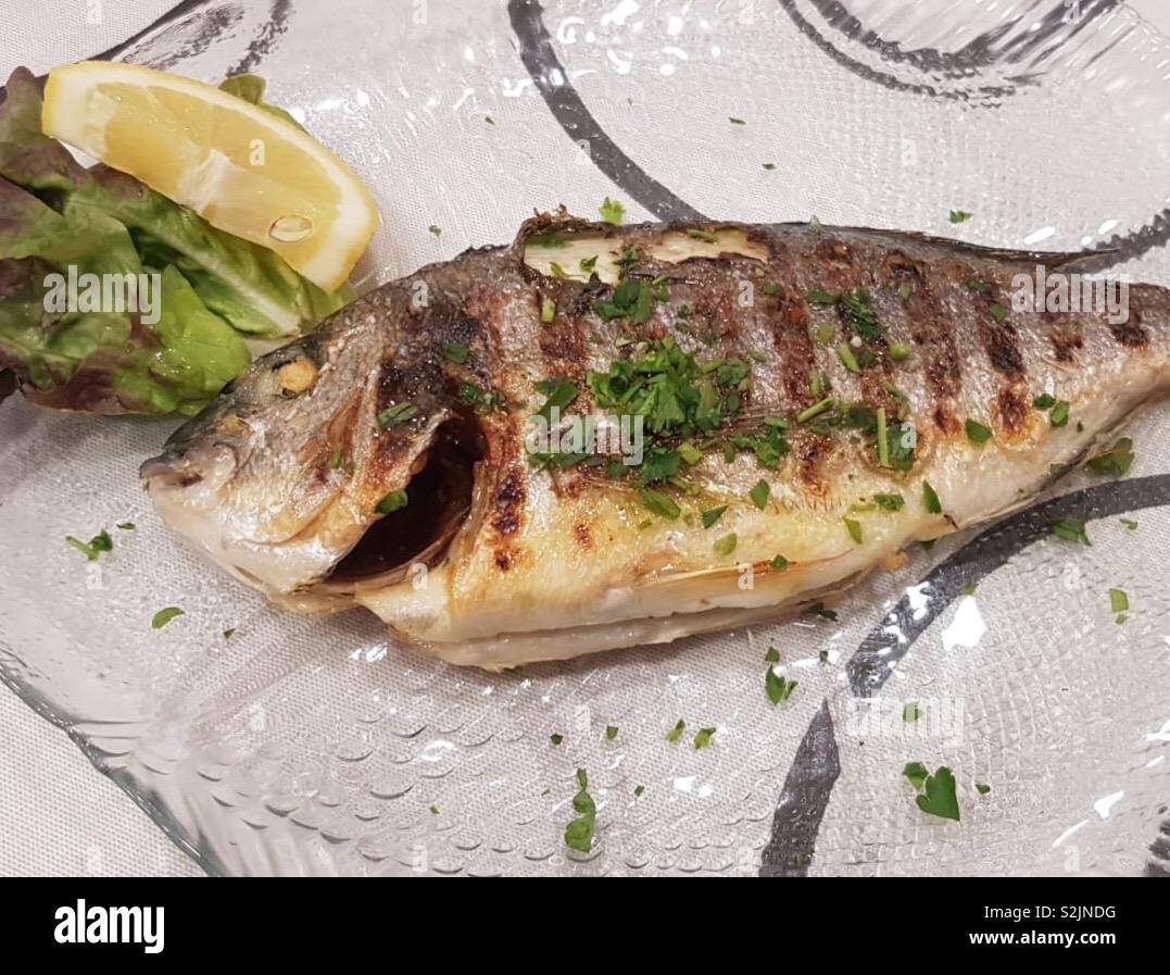 Grilled fish dish Stock Photo - Alamy