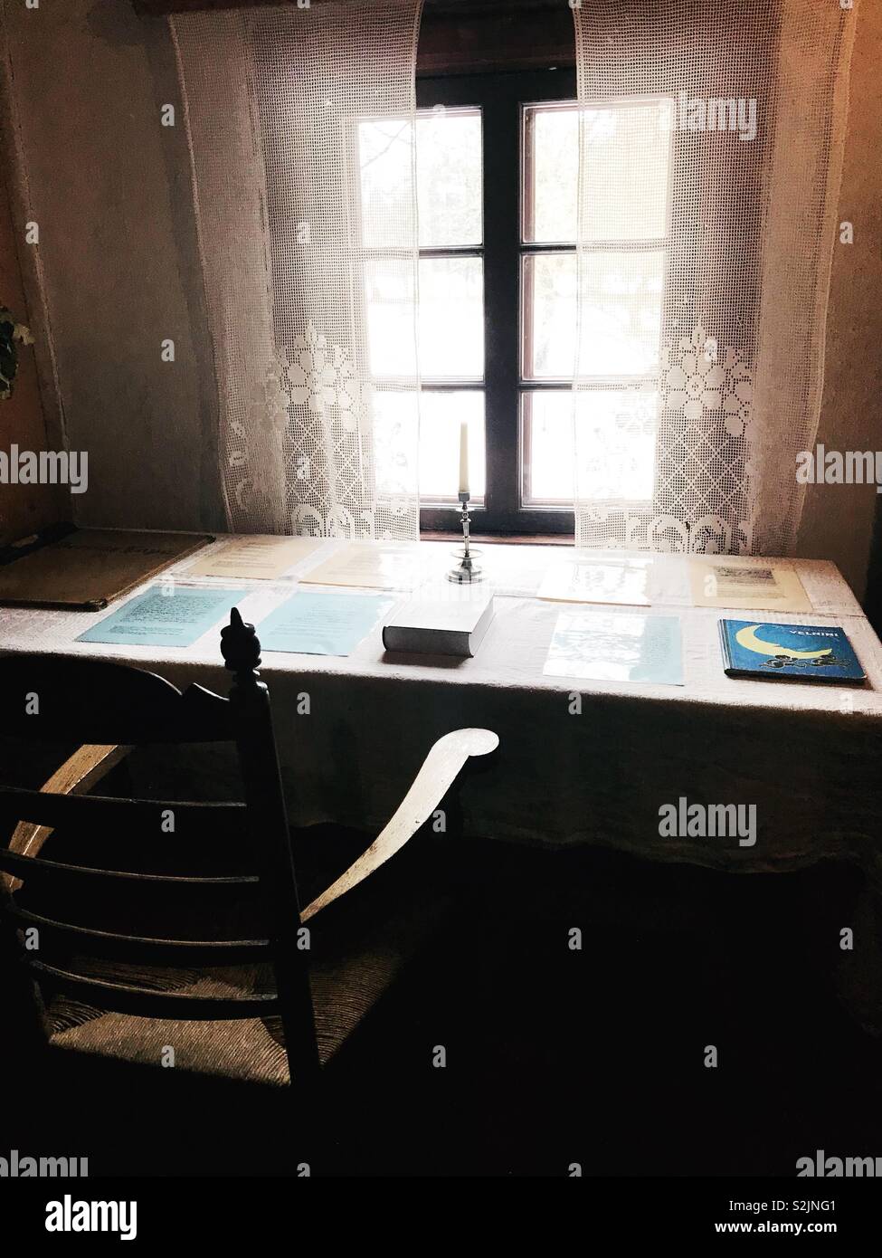 Table by the window Stock Photo - Alamy